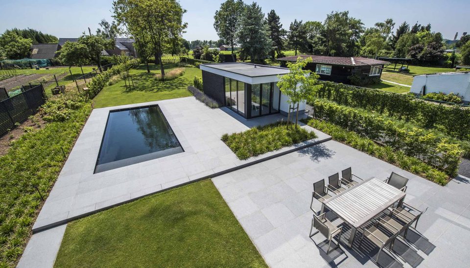 Modern garden with swimming pool and pool house