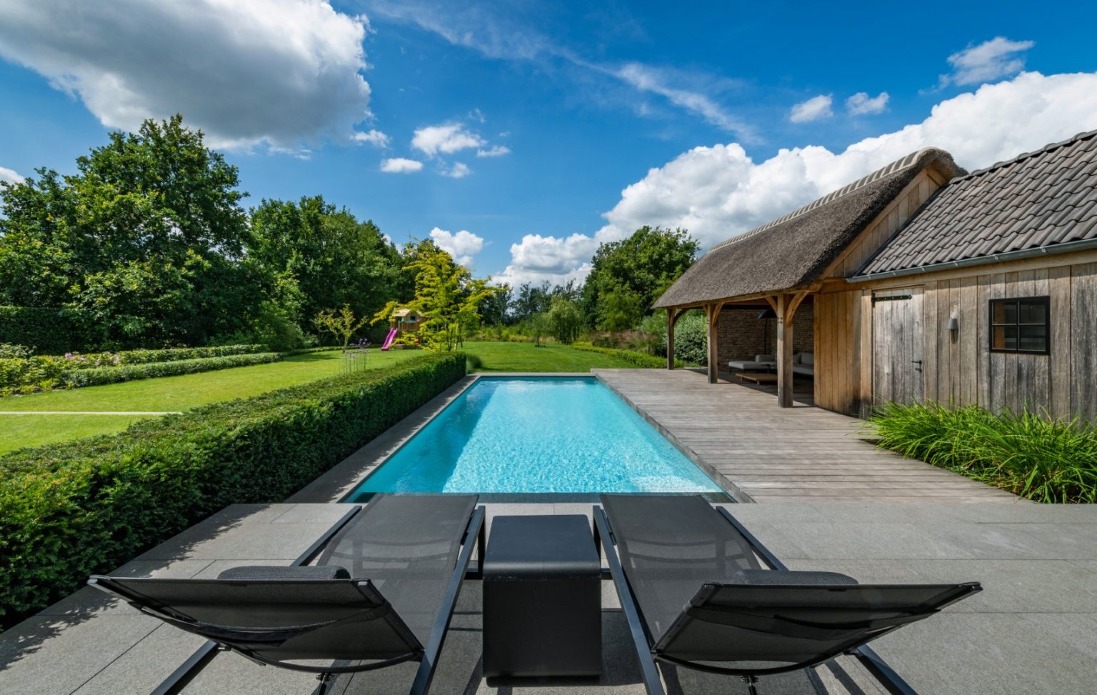Pool house with thatched roof