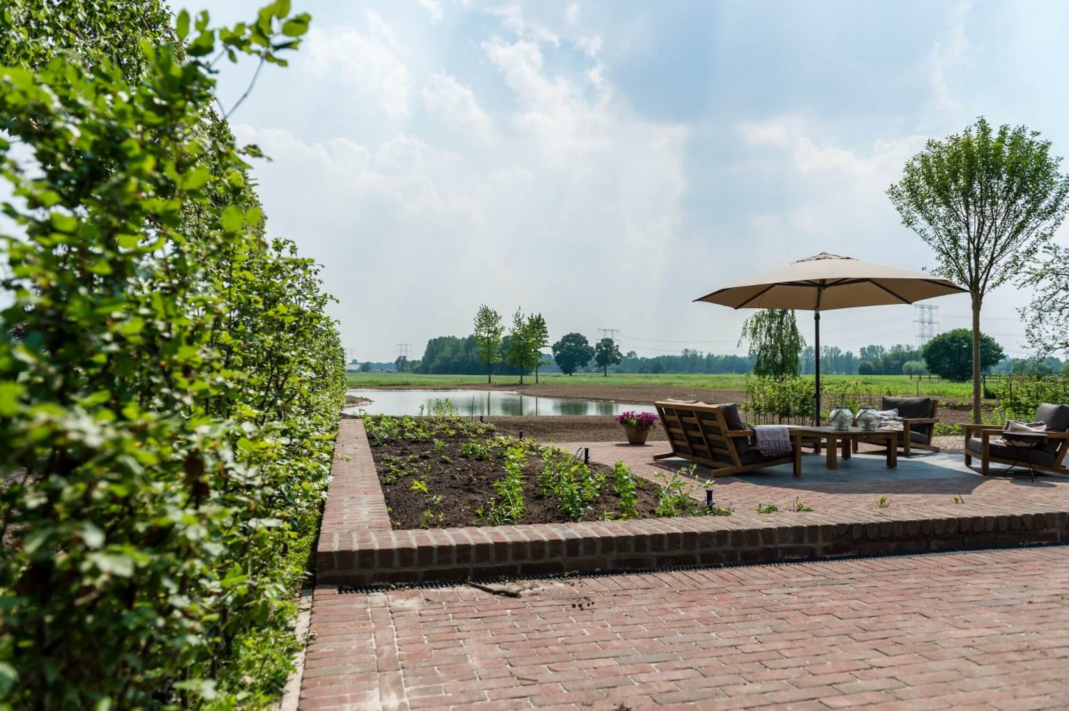 Farm garden with natural pond