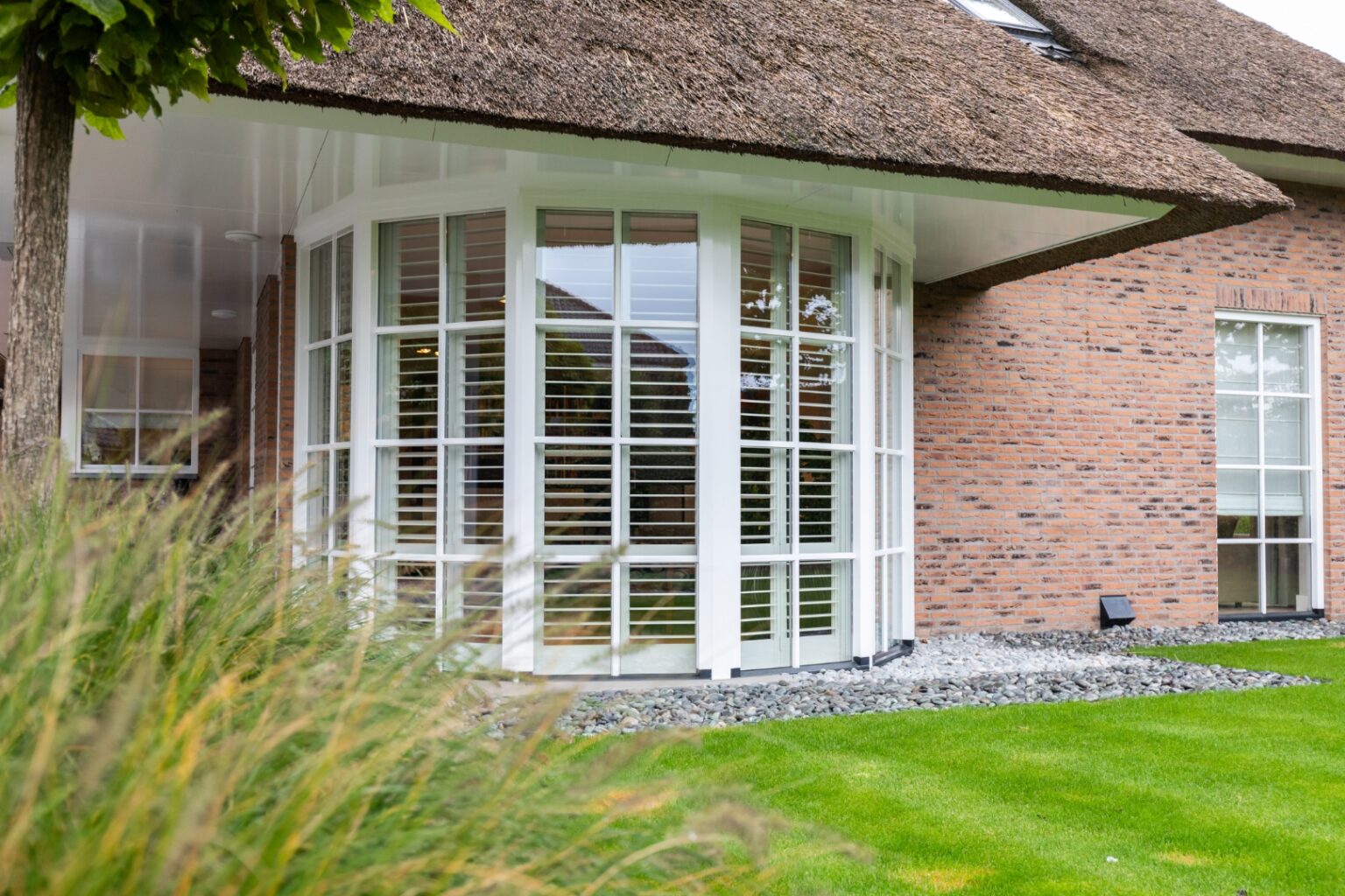 Round bay window with attractive shutters