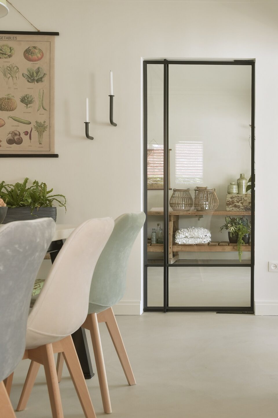 Authentic, slender steel pivot door in showroom