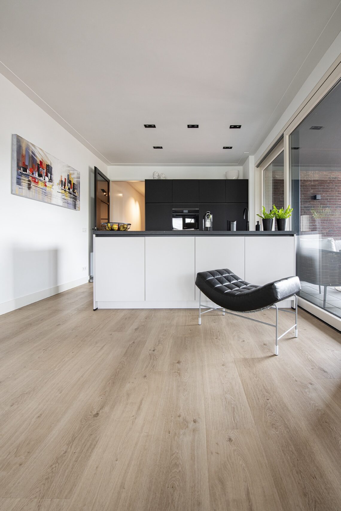 Extra brede PVC vloer in naturel tint met noestjes