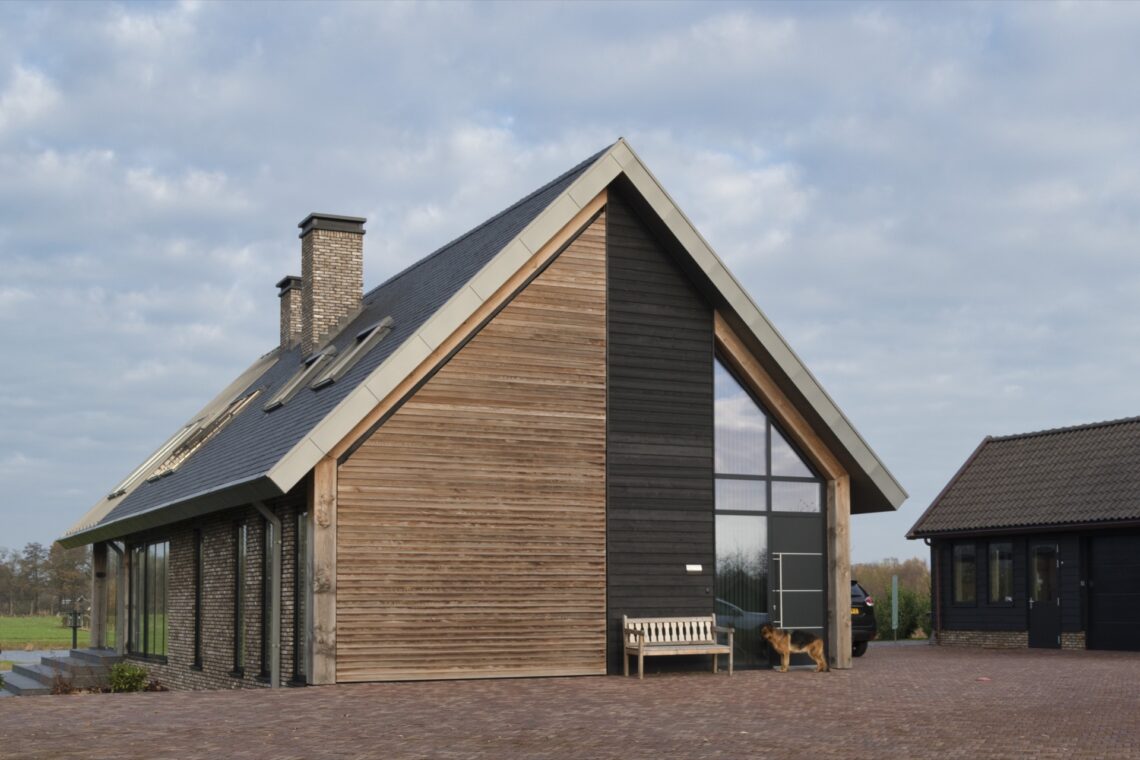 Barn house fitted with slatted western red cedar blinds