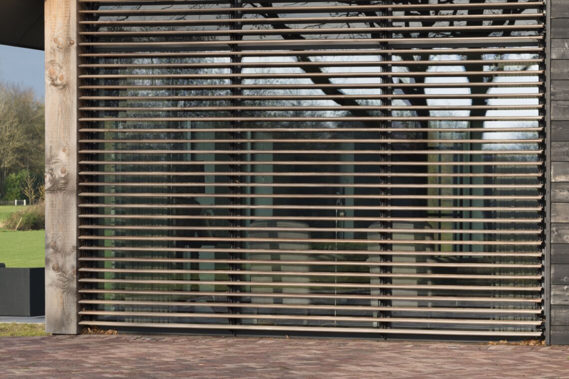 Barn house fitted with slatted western red cedar blinds