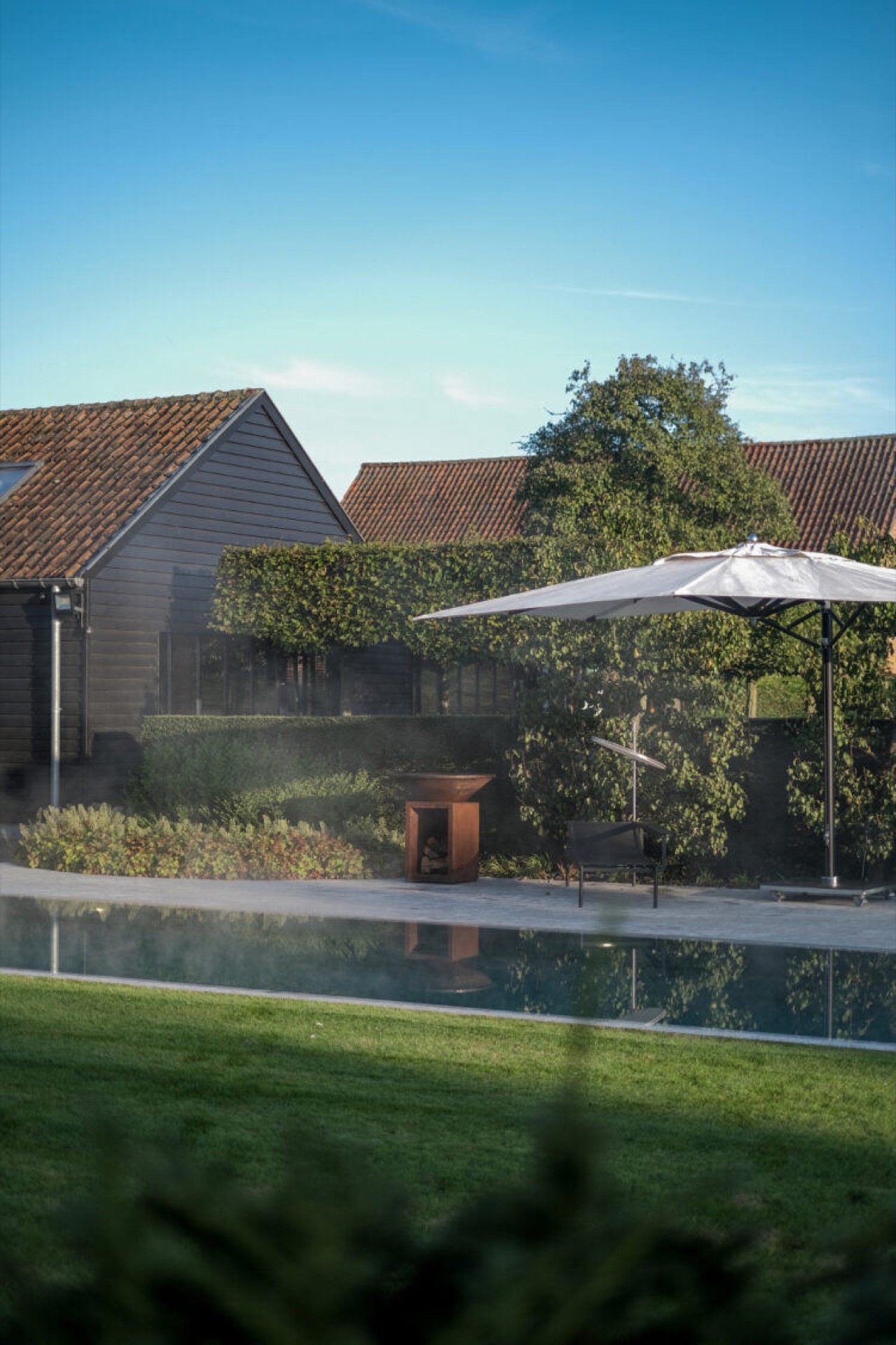 Overflow pool with exposed concrete finish
